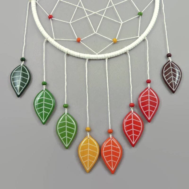 White dreamcatcher with fall leaves